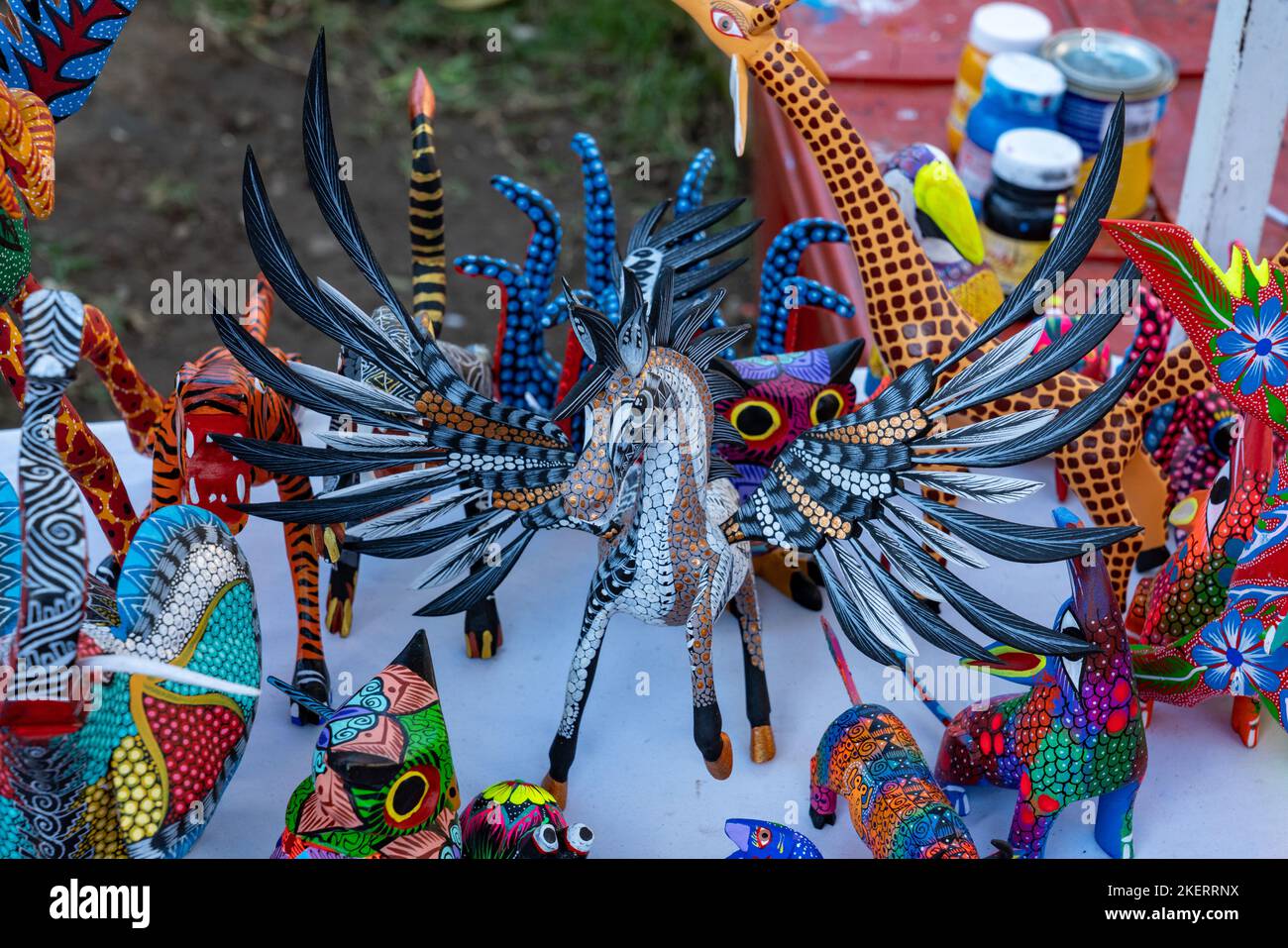 Brightly painted alebrijes carved of copal wood representing real and ...