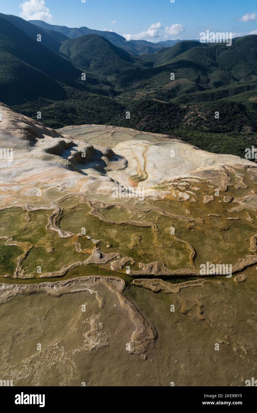 Travertine formations and a mineral pool above the Big Waterfall ...