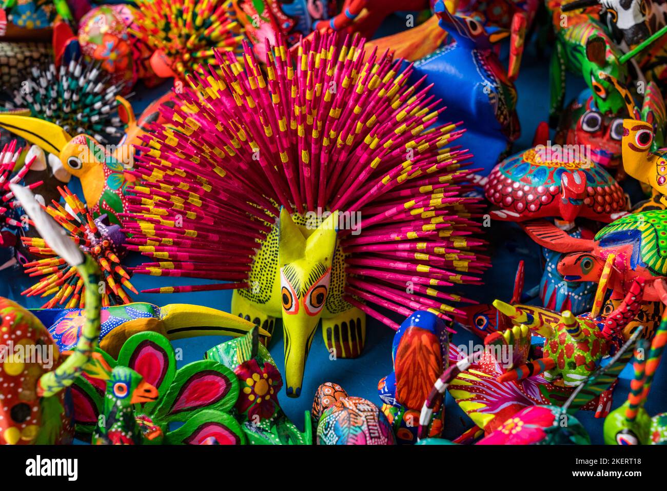 Brightly painted alebrijes carved of copal wood representing real and ...