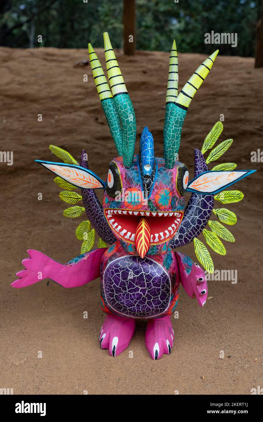 Brightly painted alebrijes carved of copal wood representing real and ...