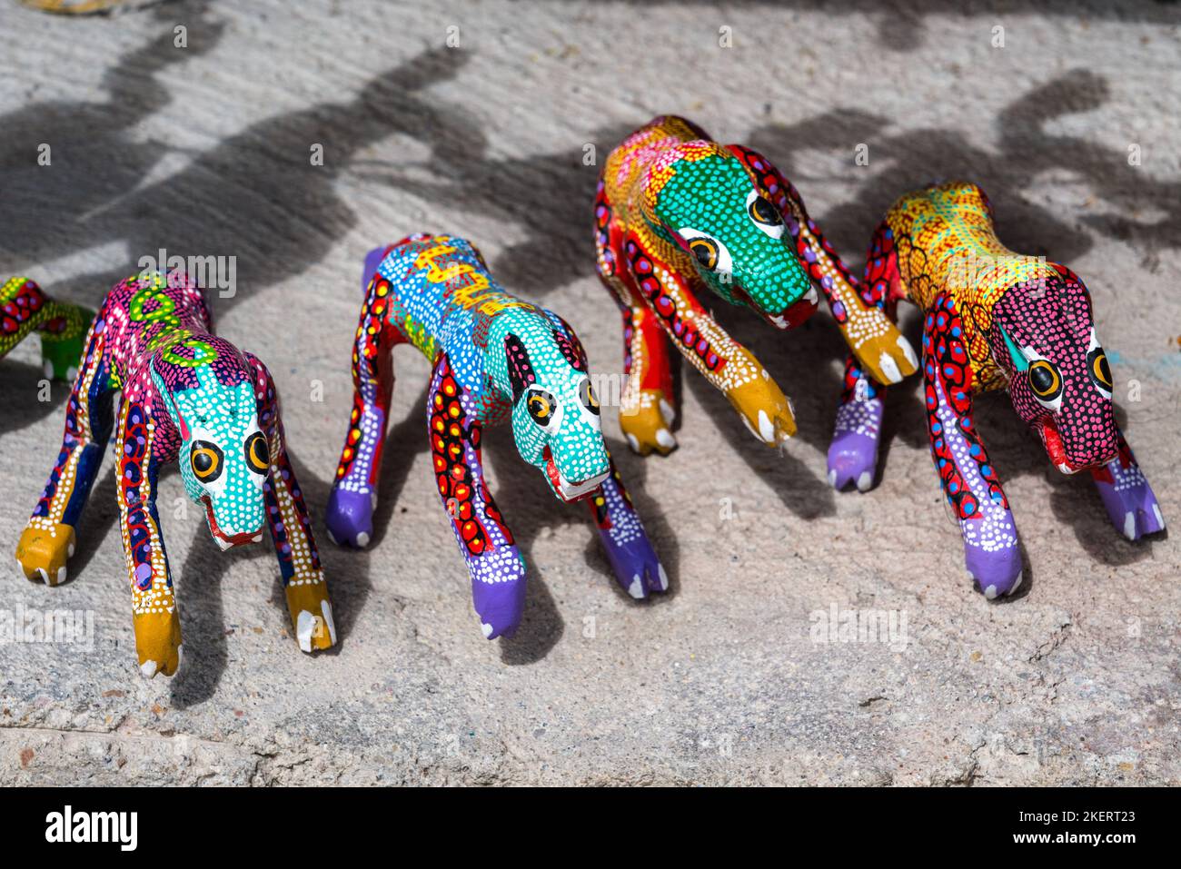 Brightly painted alebrijes carved of copal wood representing real and ...