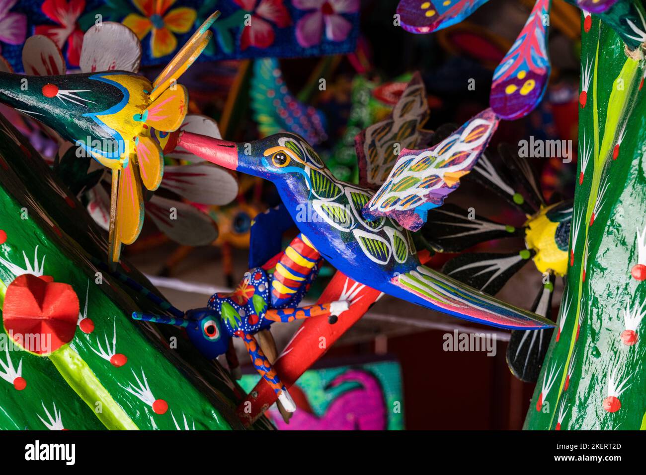 Brightly painted alebrijes carved of copal wood representing real and ...
