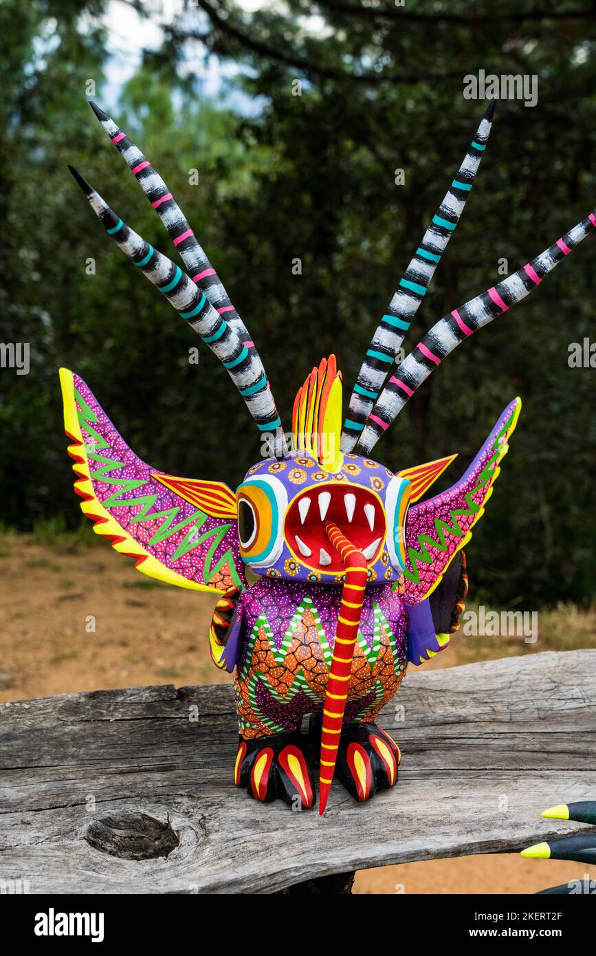 Brightly painted alebrijes carved of copal wood representing real and ...
