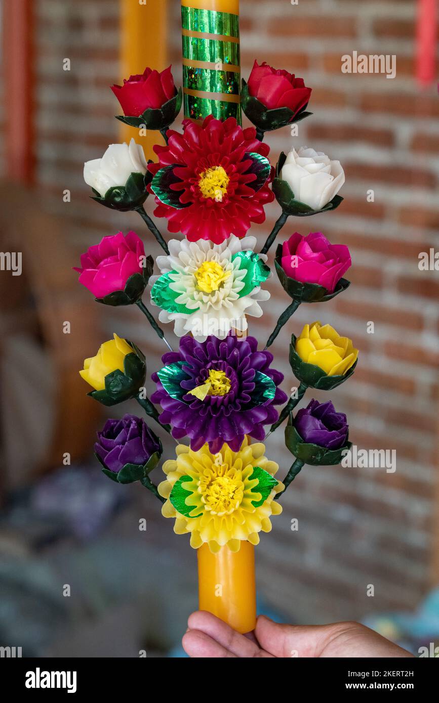 Fancy candles with elaborate wax flowers made by hand in a workshop in ...