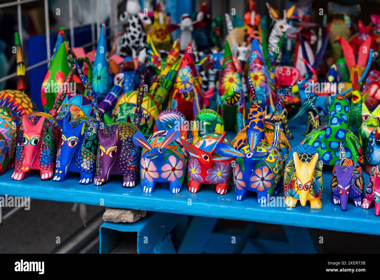 Brightly painted alebrijes carved of copal wood representing real and ...