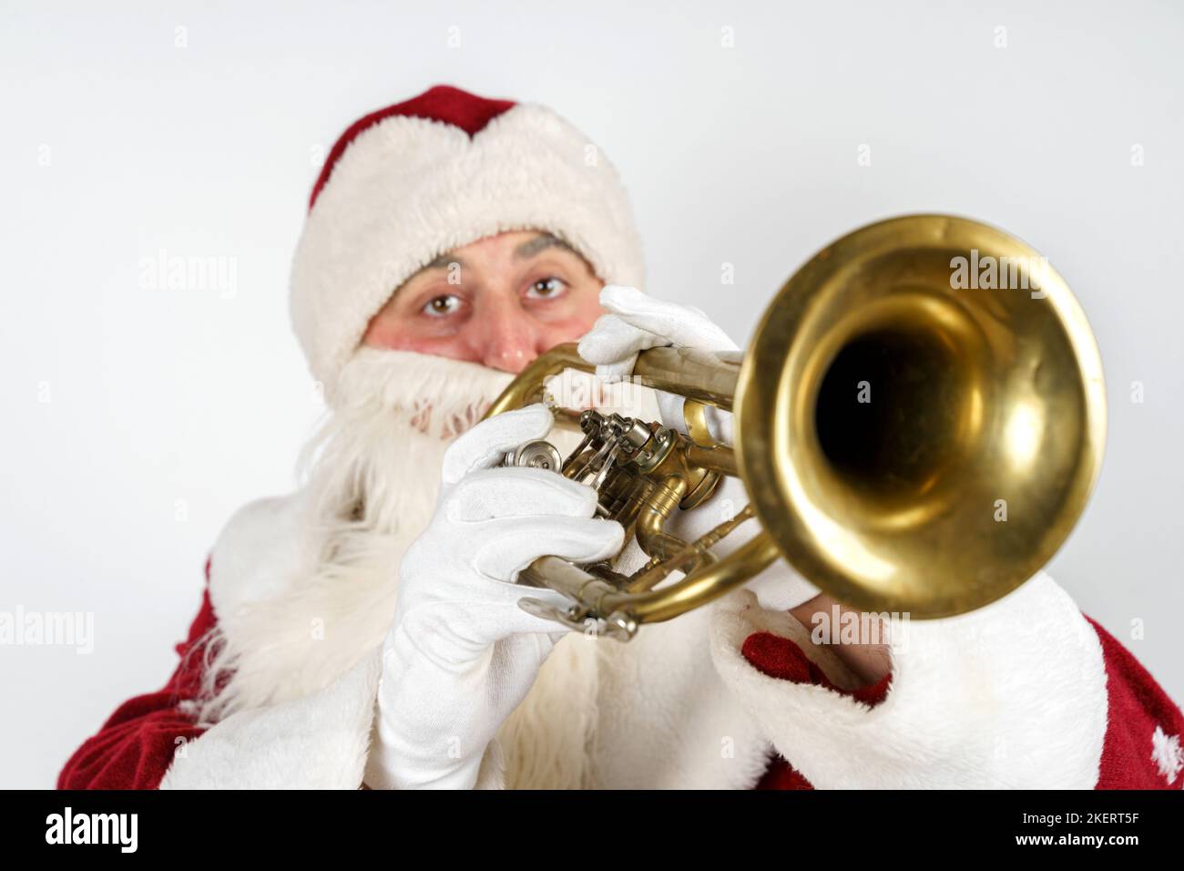 New Year and Christmas concept. Santa Claus plays the pipe. Isolated ...