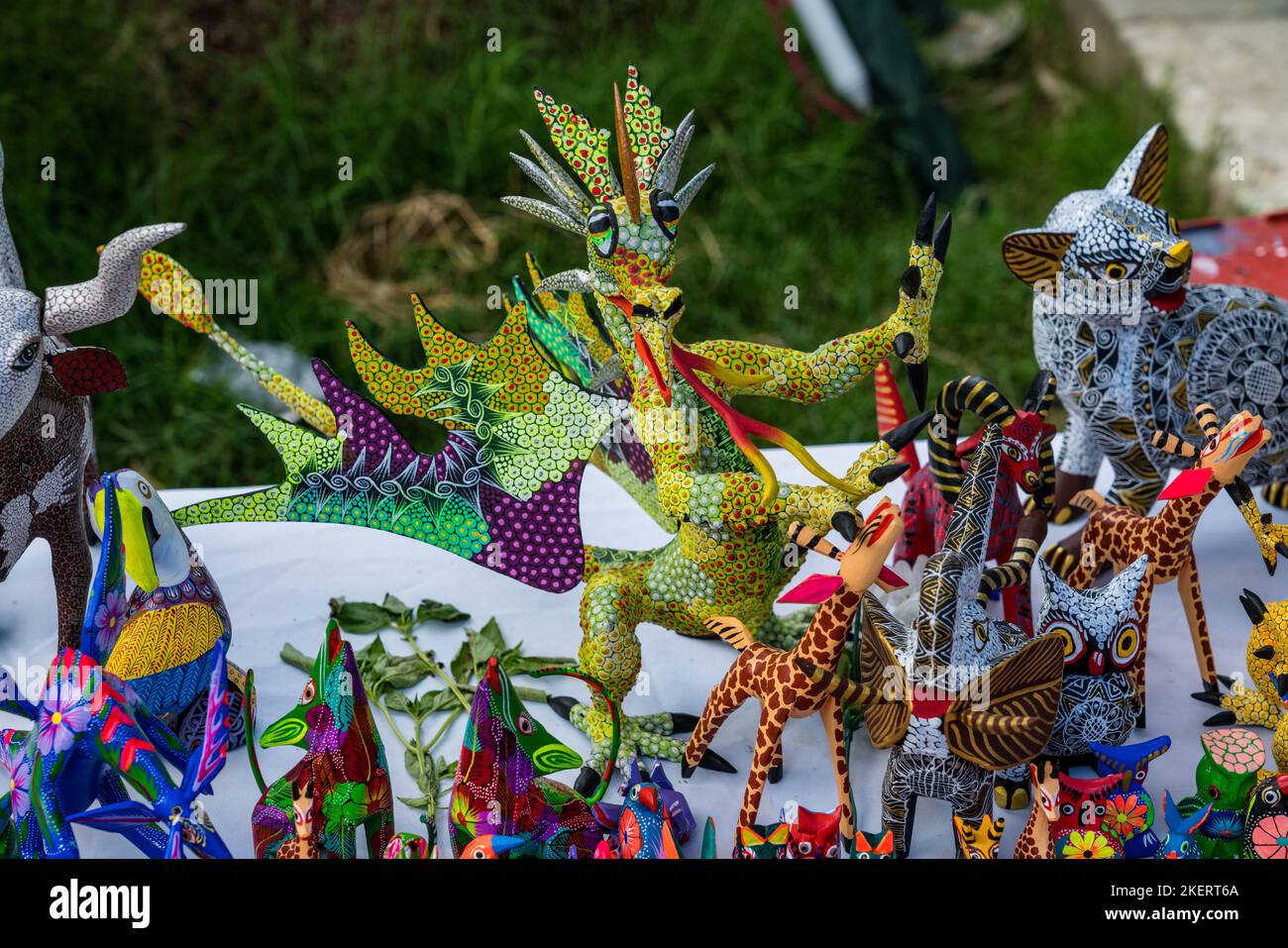 Brightly painted alebrijes carved of copal wood representing real and ...