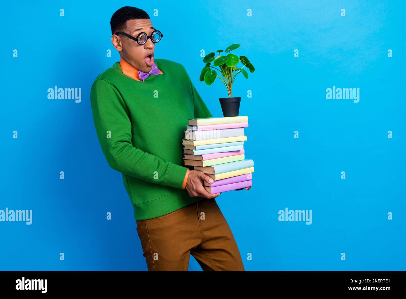Photo of young nerd student scared guy wear classic outfit bowtie hold ...