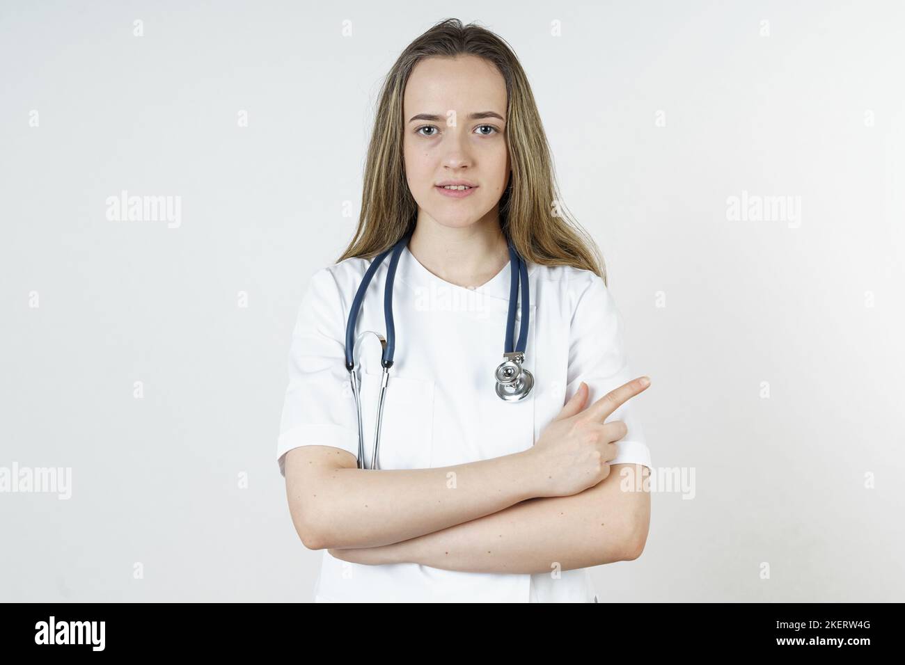 Medicine and health concept. Doctor pointing to the side. Isolated on ...