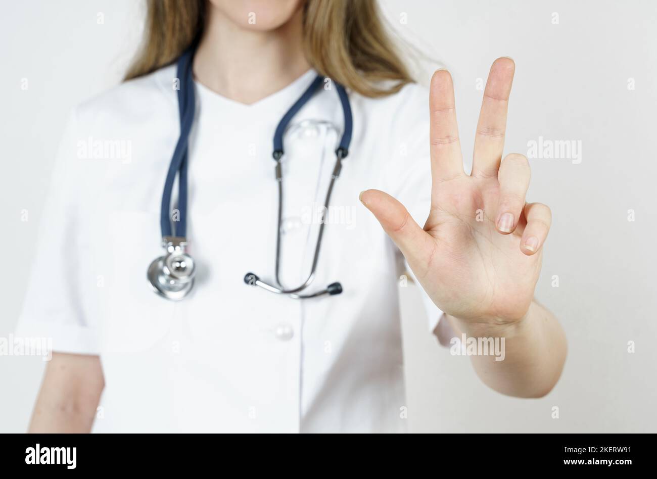 Medicine and health concept. The doctor makes a countdown with his ...