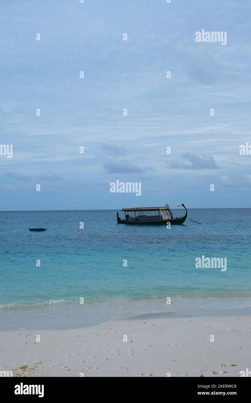 A Dhoni is a traditional multi-purpose sailvessel with a motor or ...
