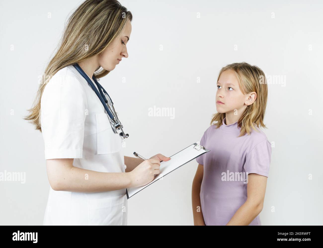 Medicine and health concept. A young female doctor takes a teenage girl ...