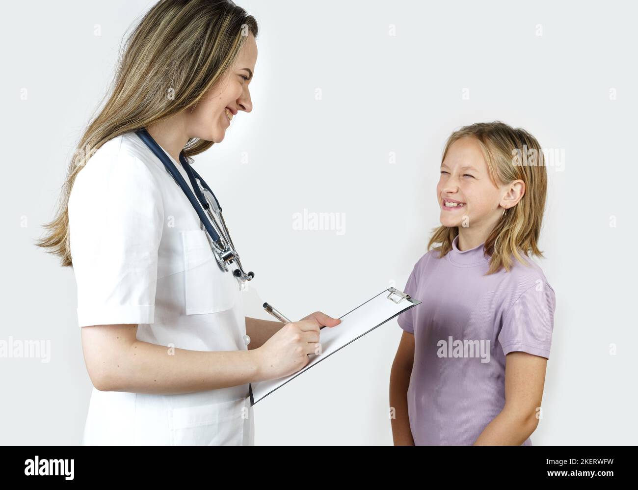 Medicine and health concept. A young female doctor takes a teenage girl ...