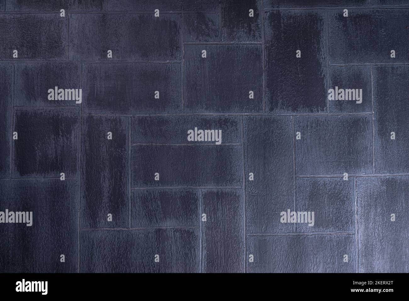 Black tiled background, empty copy space for text. Stone wall pattern ...