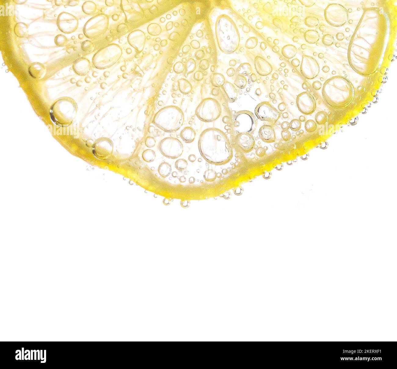 Juicy lime slices with bubbles under water isolated on white background. Yellow lemon slices ...