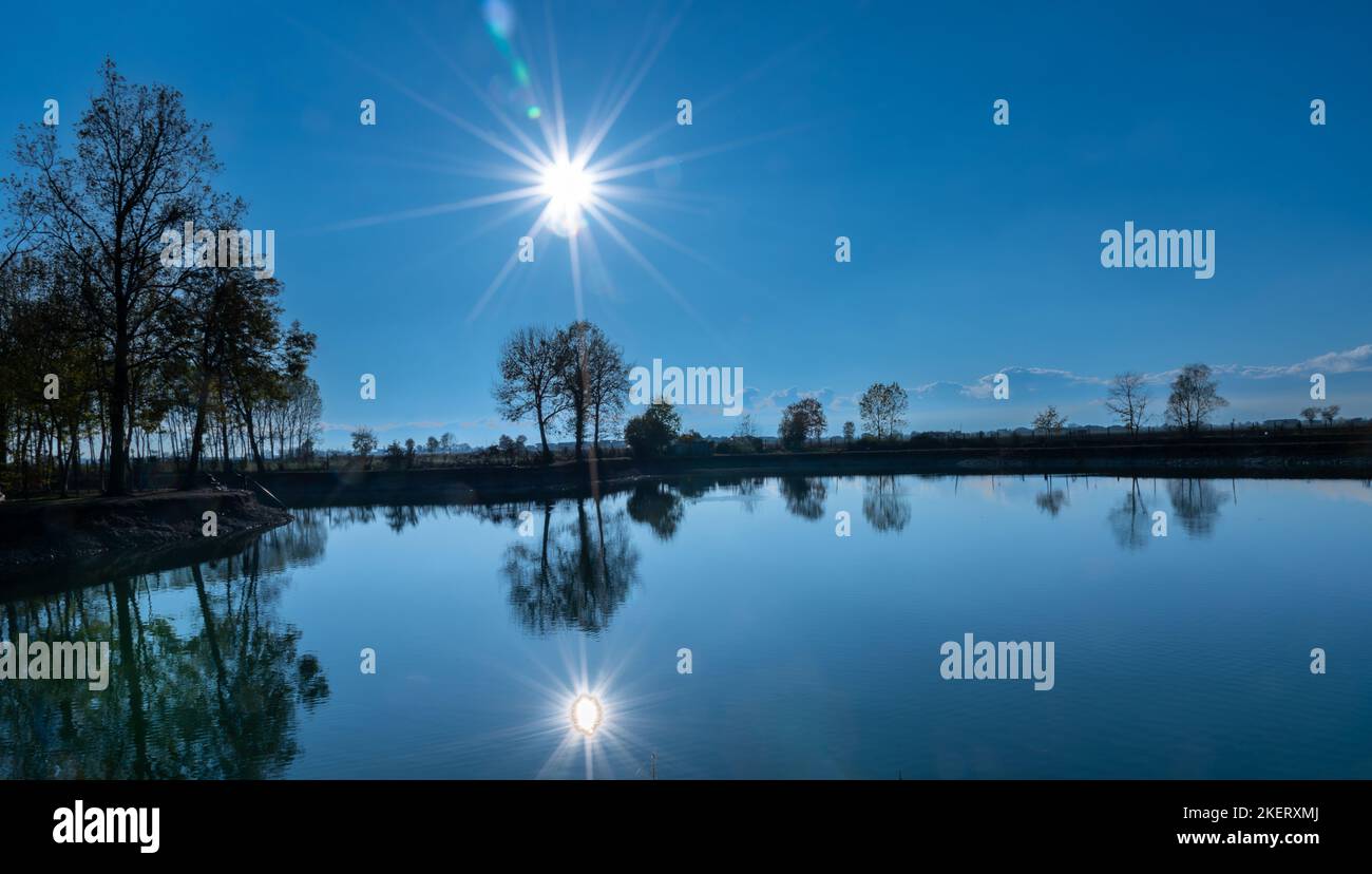 Landscape of lake with sun reflection which is on blue sky, Silhouette ...
