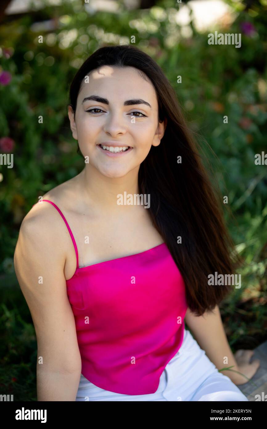 Brunette teenager girl smiling - Portrait of a happy lovely and ...