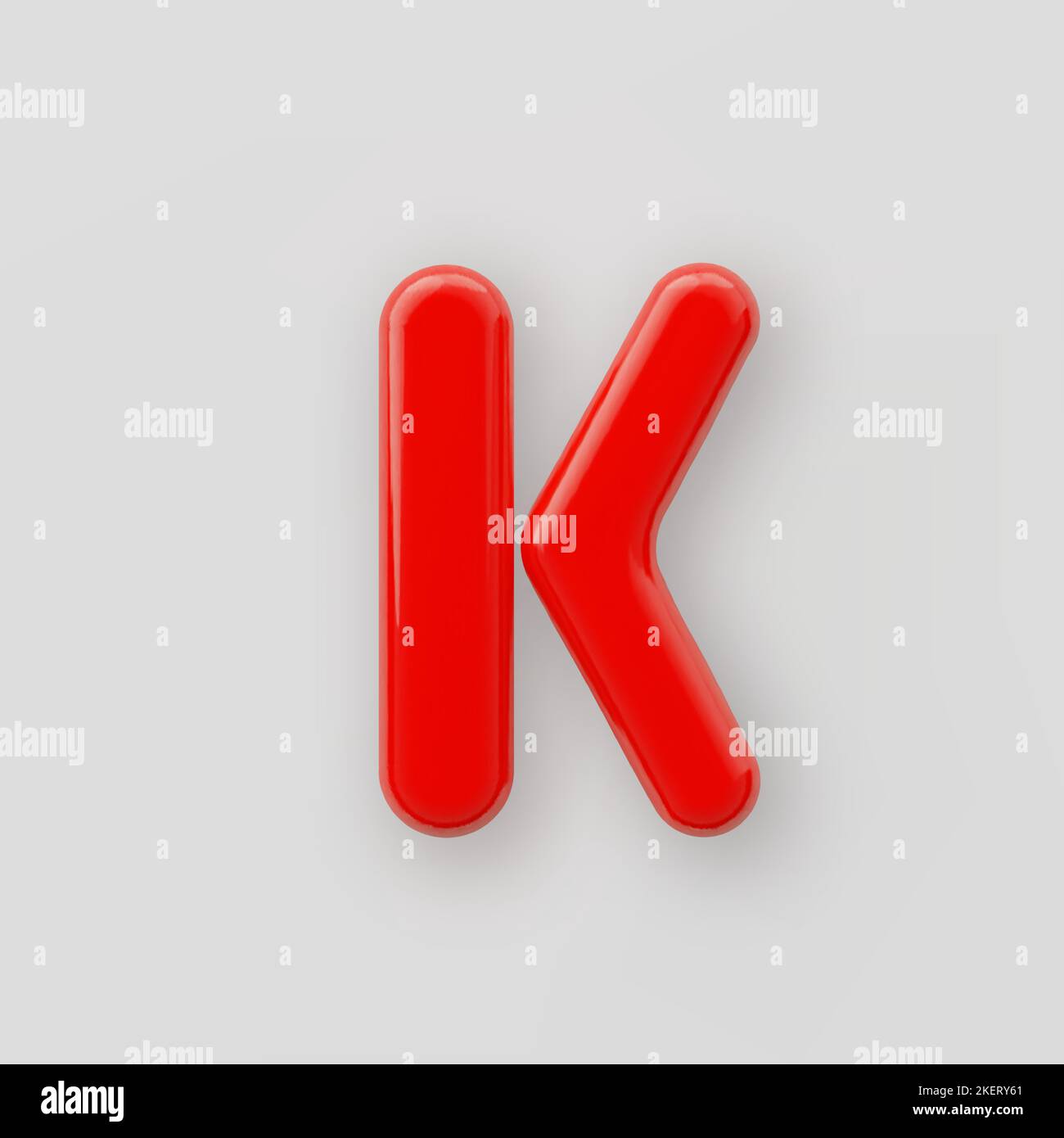 3D Red plastic uppercase letter K with a glossy surface on a gray ...