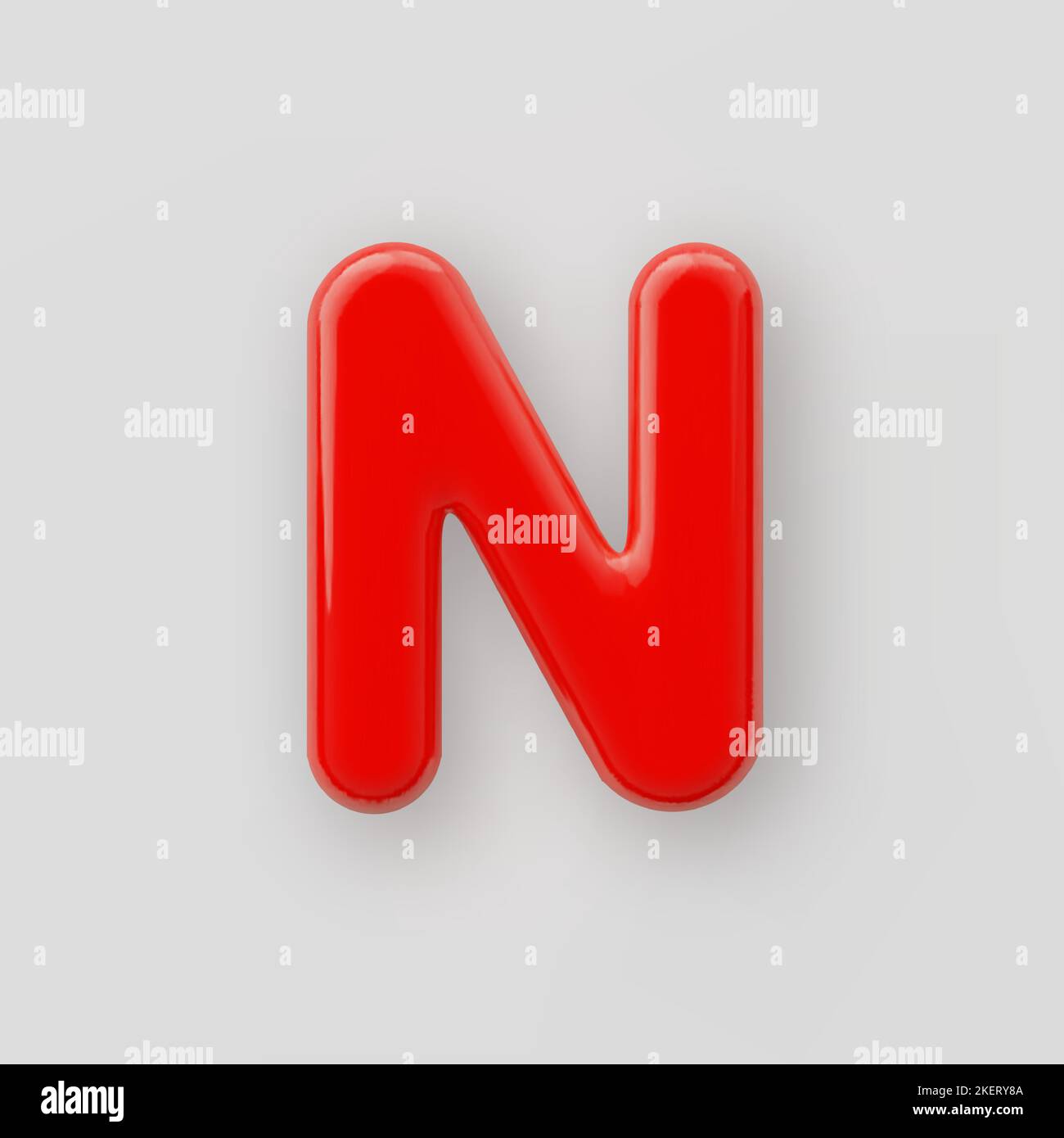 3D Red plastic uppercase letter N with a glossy surface on a gray ...