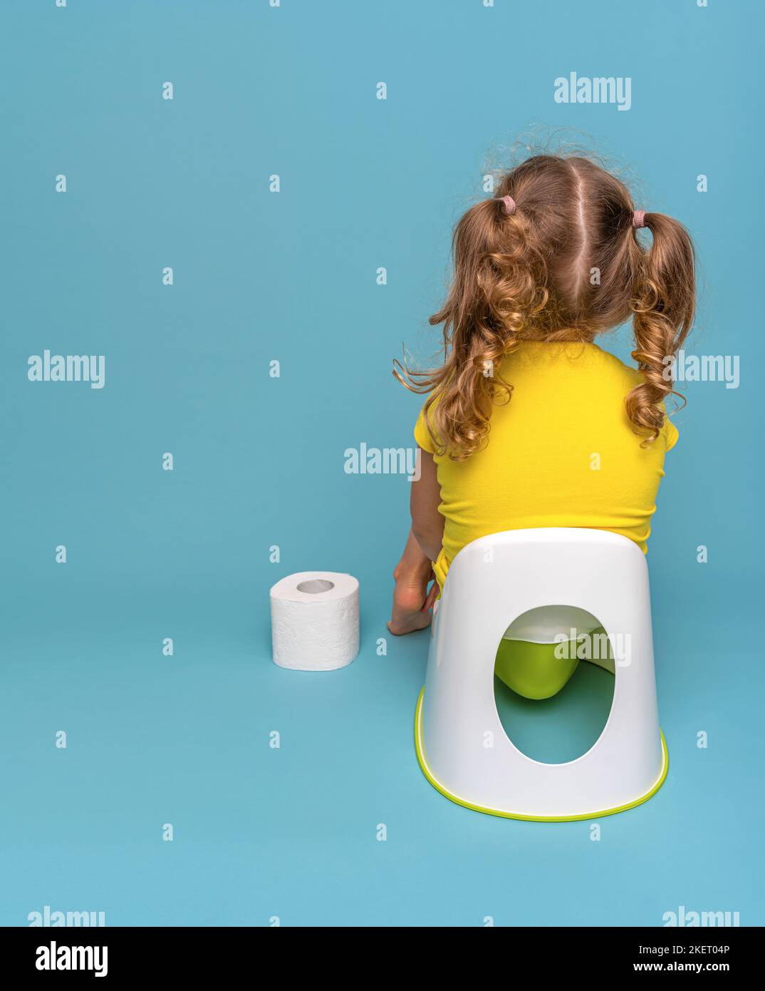 Baby on the potty back view Stock Photo - Alamy