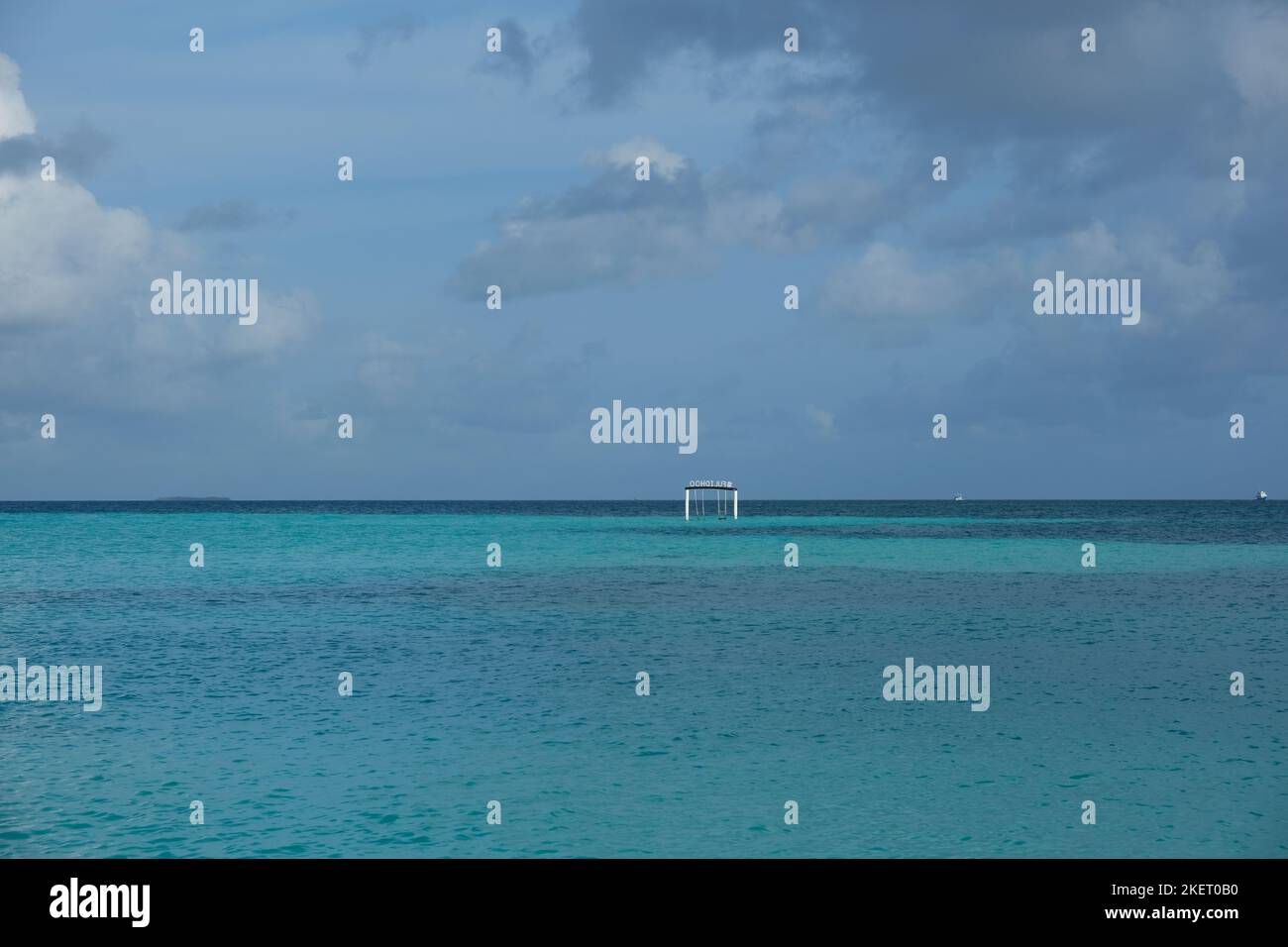 A swing at the middle of sea at Fulidhoo, Maldives Stock Photo - Alamy