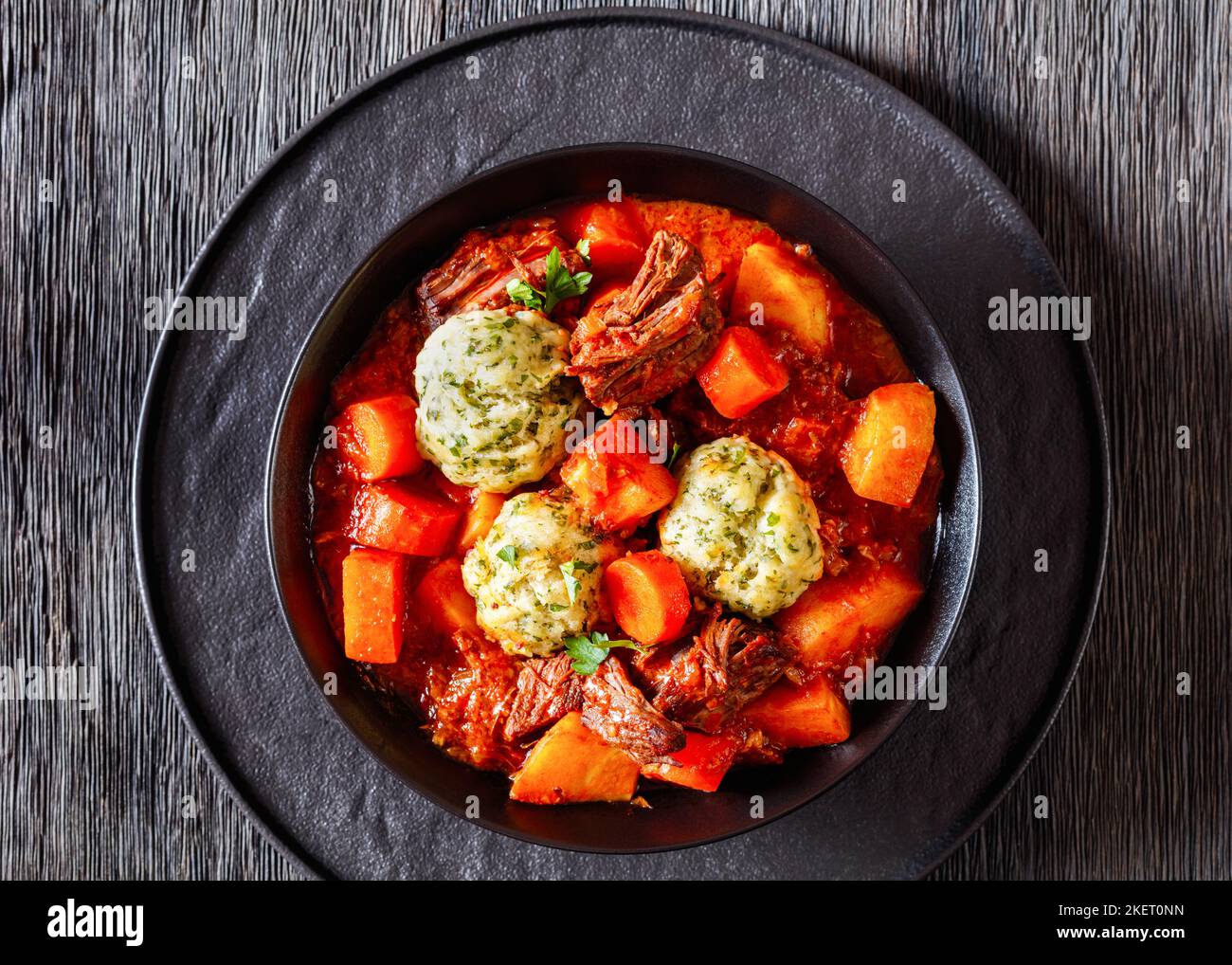 Beef Stew with Dumplings and vegetables in rich tomato and stock based ...