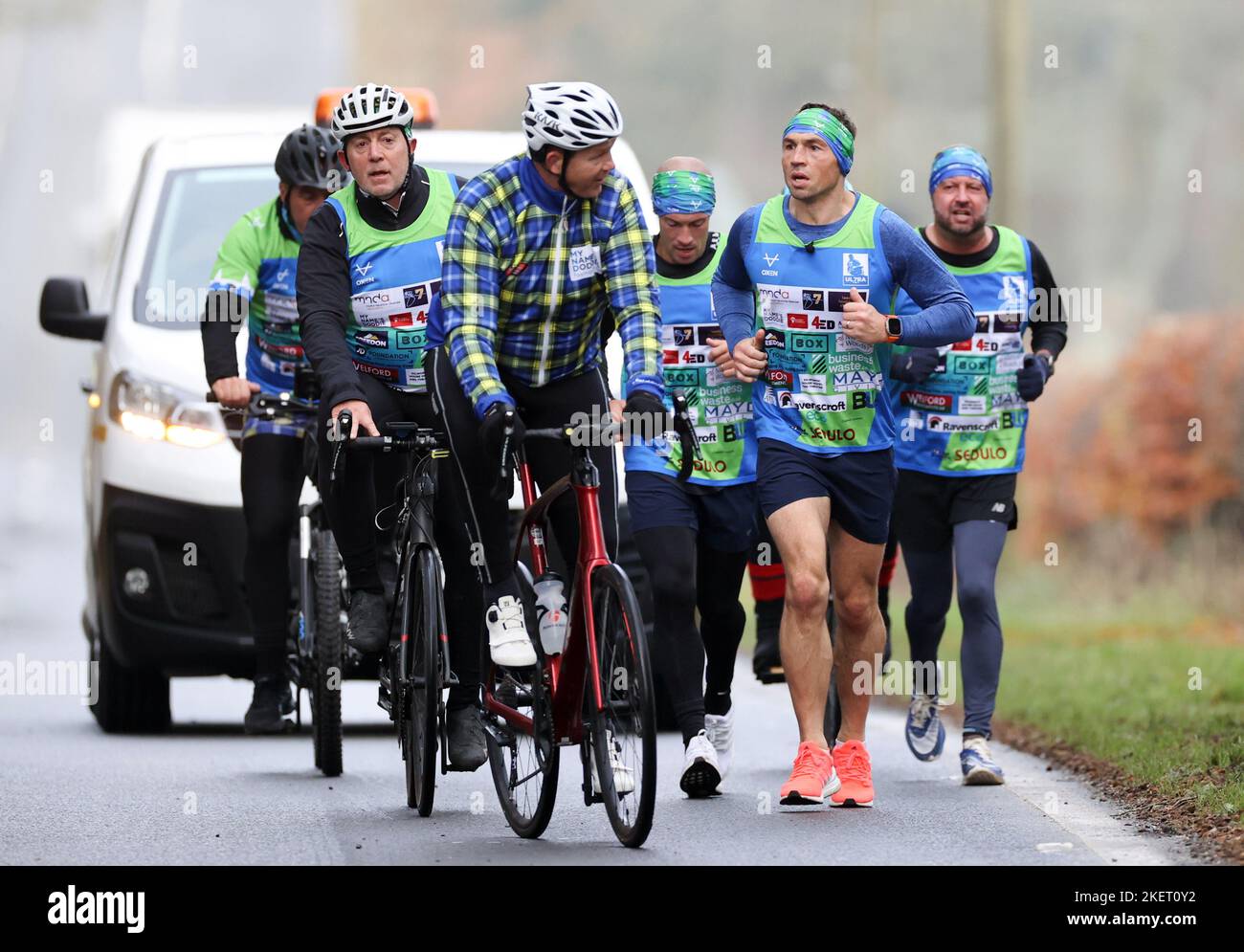 Kevin Sinfield (second right) arrives at his first official stop ...