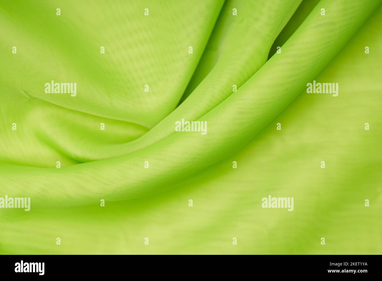 green silk. wavy background fabric Stock Photo - Alamy
