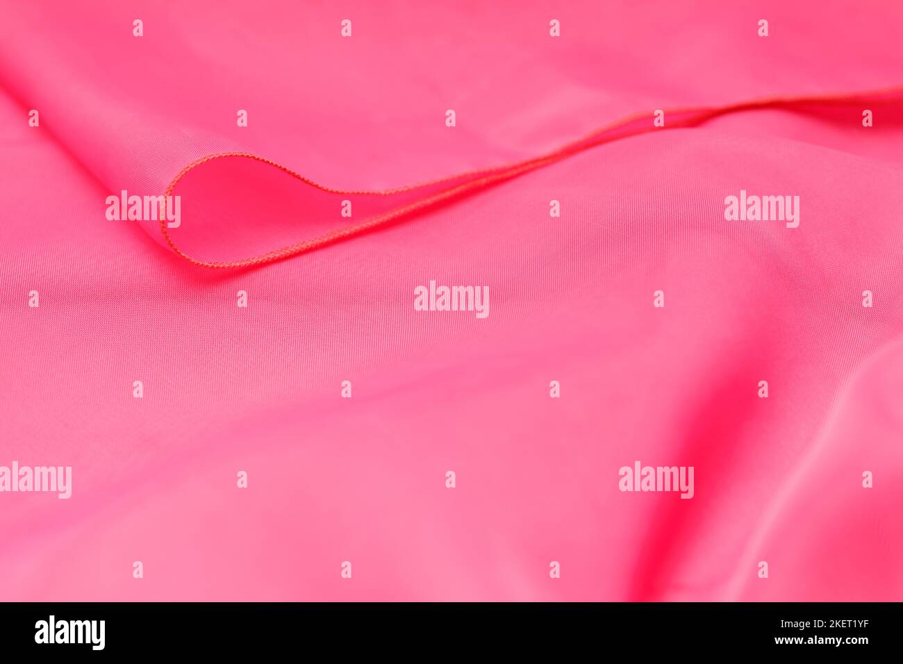pink silk. wavy fabric. background for design Stock Photo - Alamy