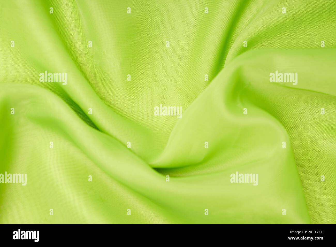 beautiful green silk. wavy fabric Stock Photo - Alamy