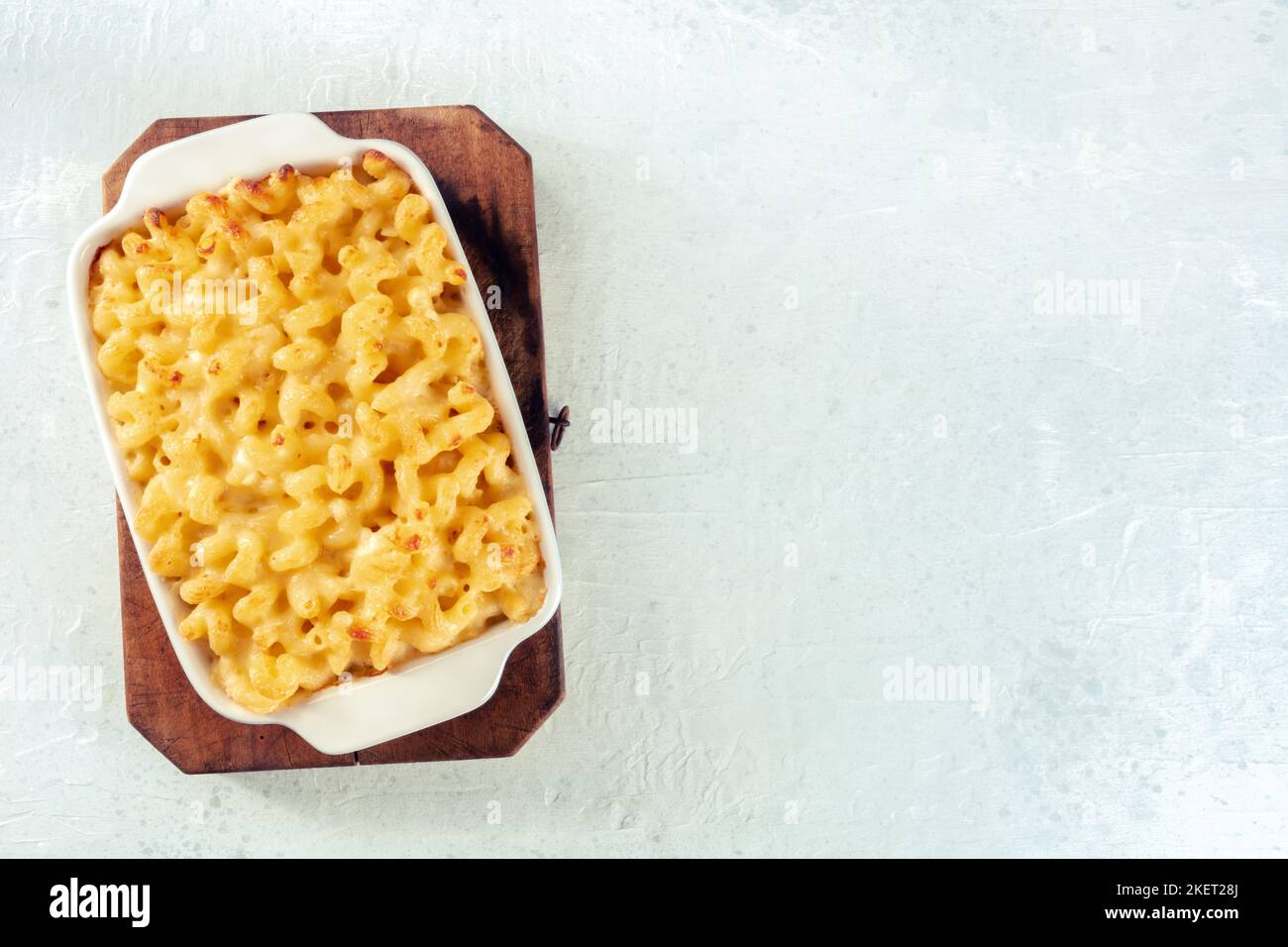 Macaroni and cheese pasta in a casserole, shot from the top. Cheesy ...