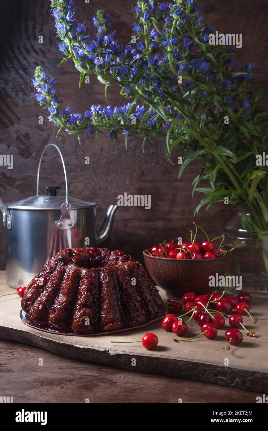 Composition on dark wooden background - delicious chocolate cake with ...