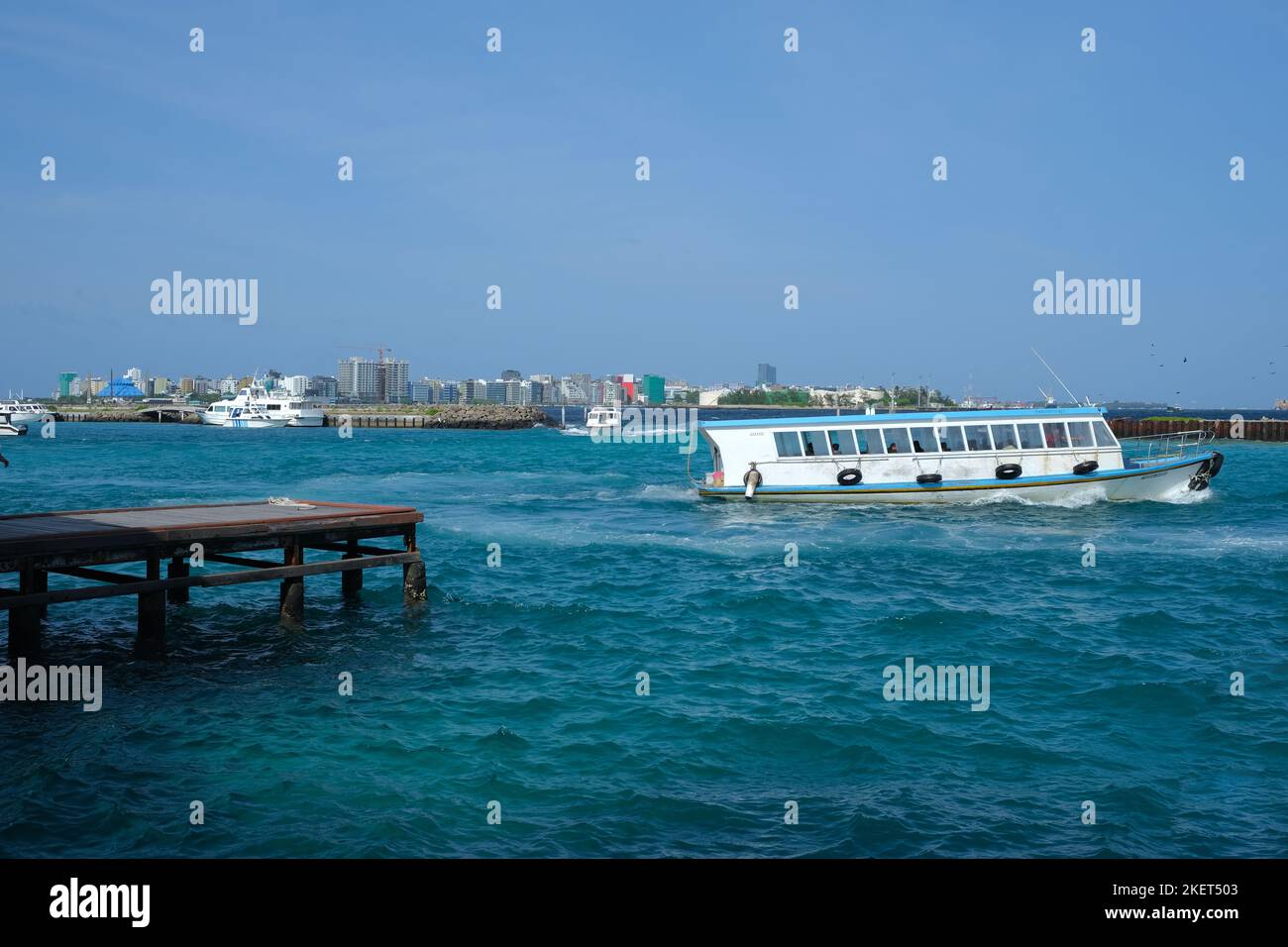 The harbour at Male International Airport Maldives with ferry crossing ...