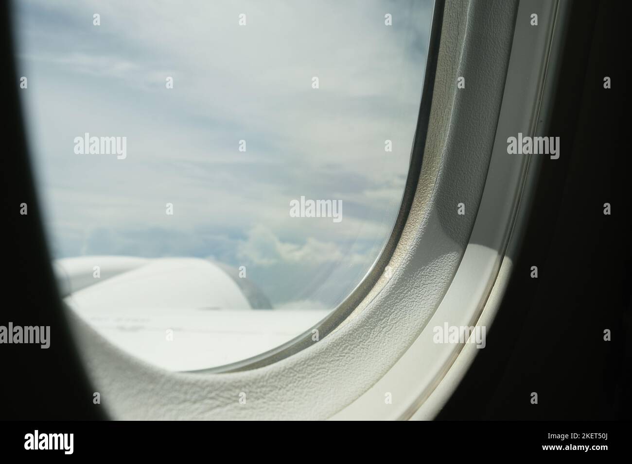 The aeroplane window with the cloud scene Stock Photo - Alamy
