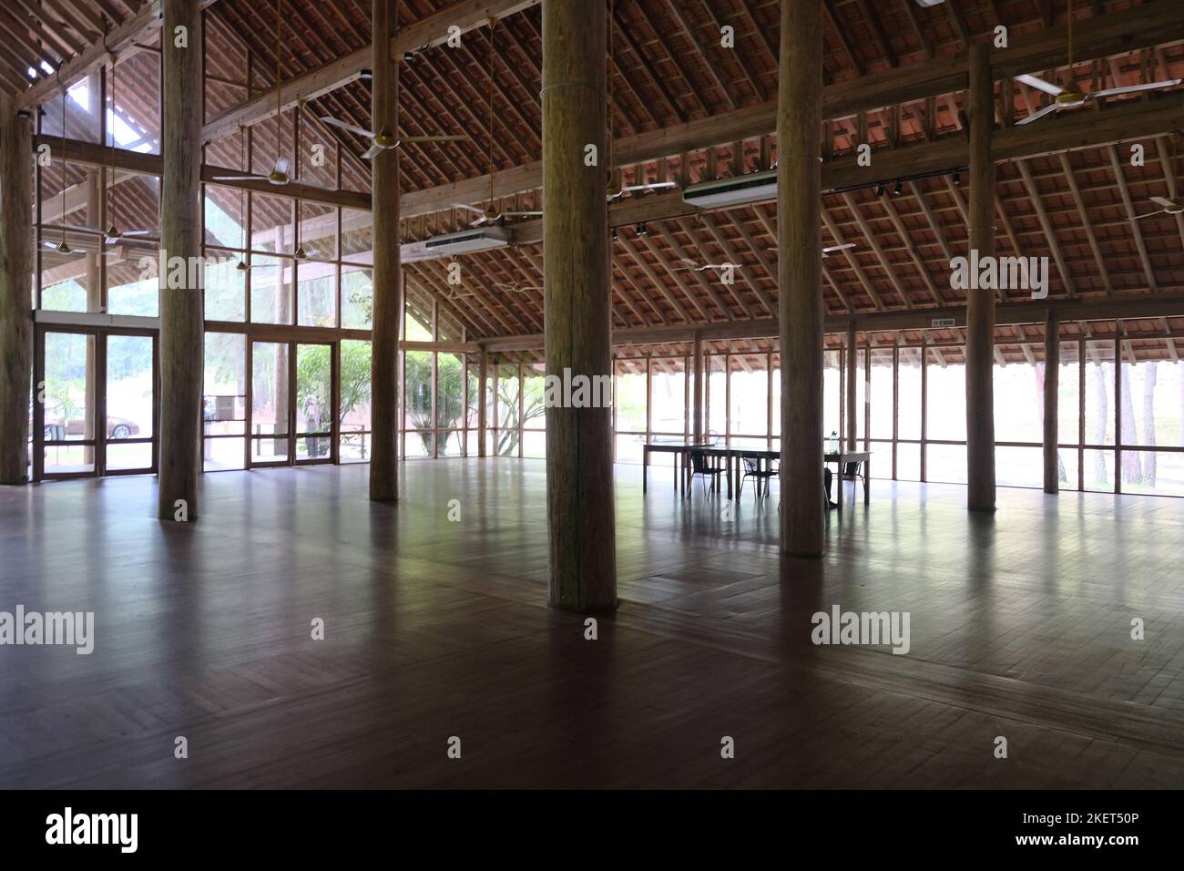 A wooden made hall with a spacious social area and corridor at Janda ...