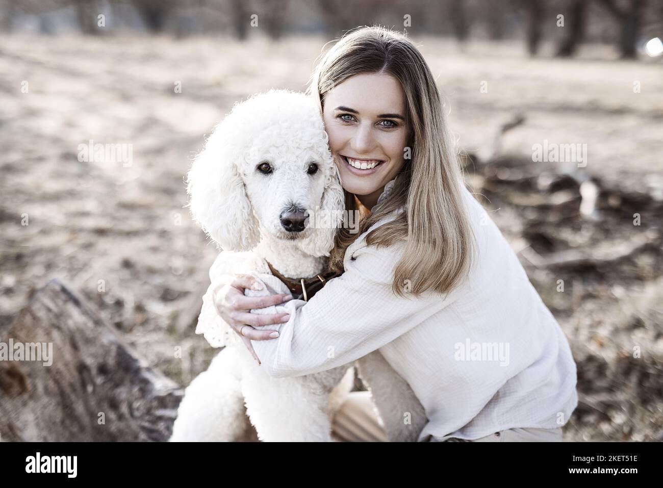 woman with Giant Poodle Stock Photo - Alamy