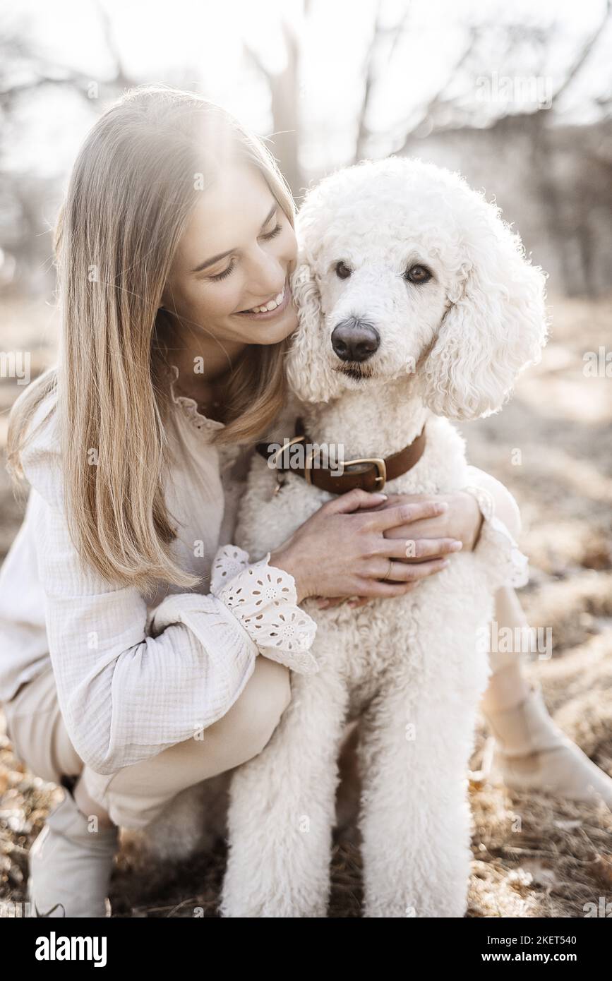 woman with Giant Poodle Stock Photo - Alamy