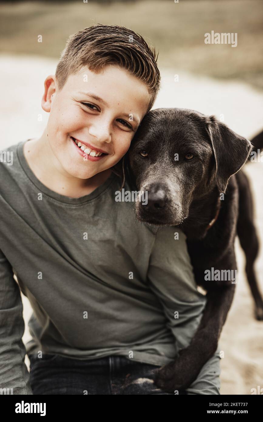 Labrador Retriever and boy Stock Photo - Alamy