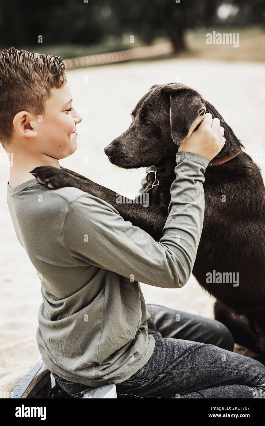 Labrador Retriever and boy Stock Photo - Alamy