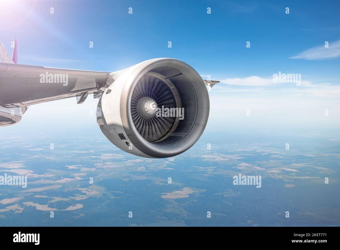 View of the engine on the wing of the aircraft during the flight in the ...