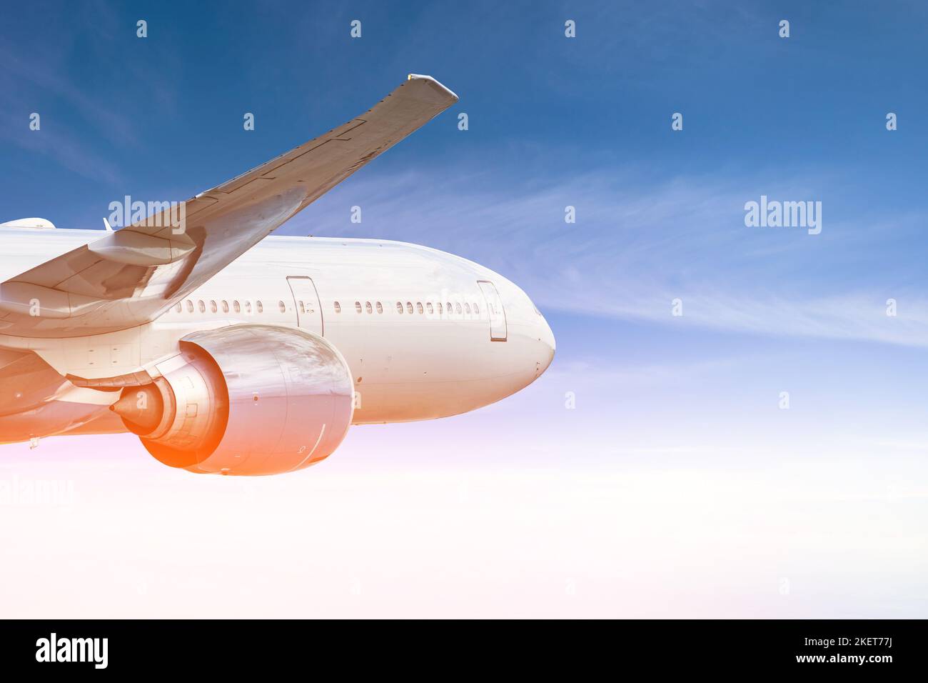 Airplane performs fly at flight level. View of the engine wing Stock ...