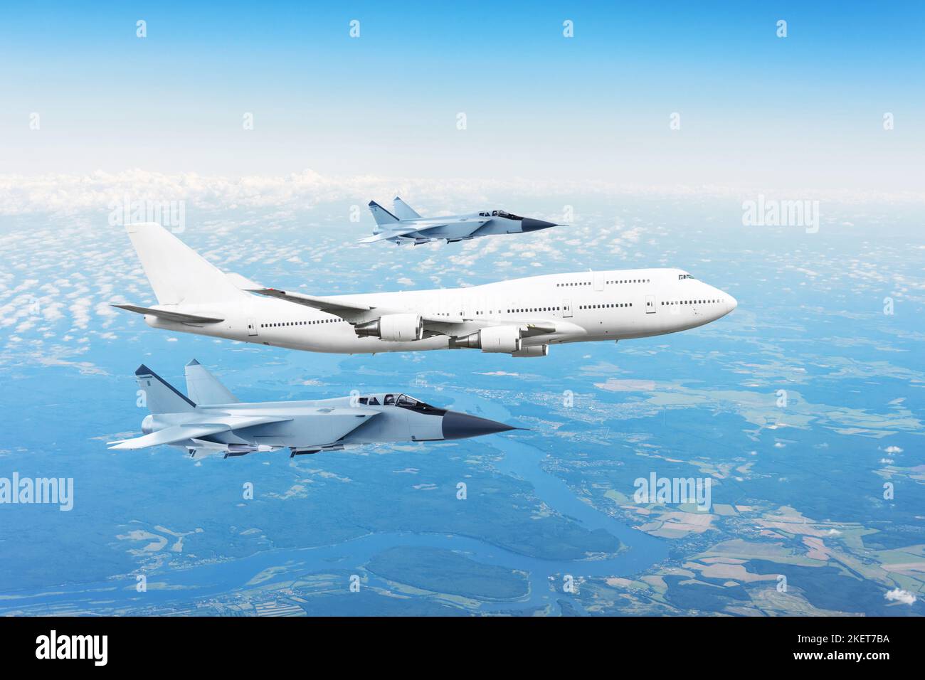 Large passenger plane, accompanied by two military fighter. Concept of ...