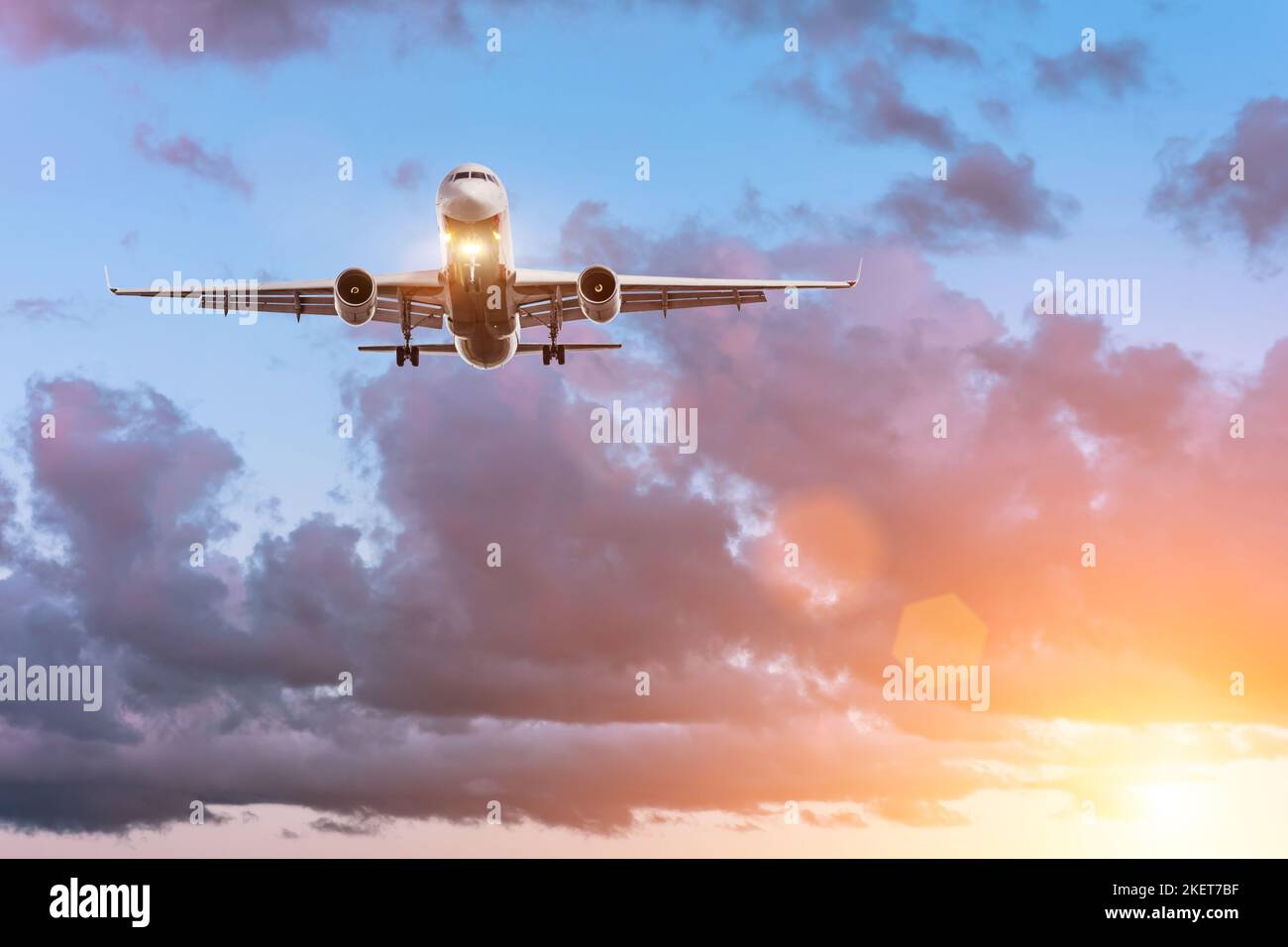 Plane on the glide path before landing on the background of a beautiful ...
