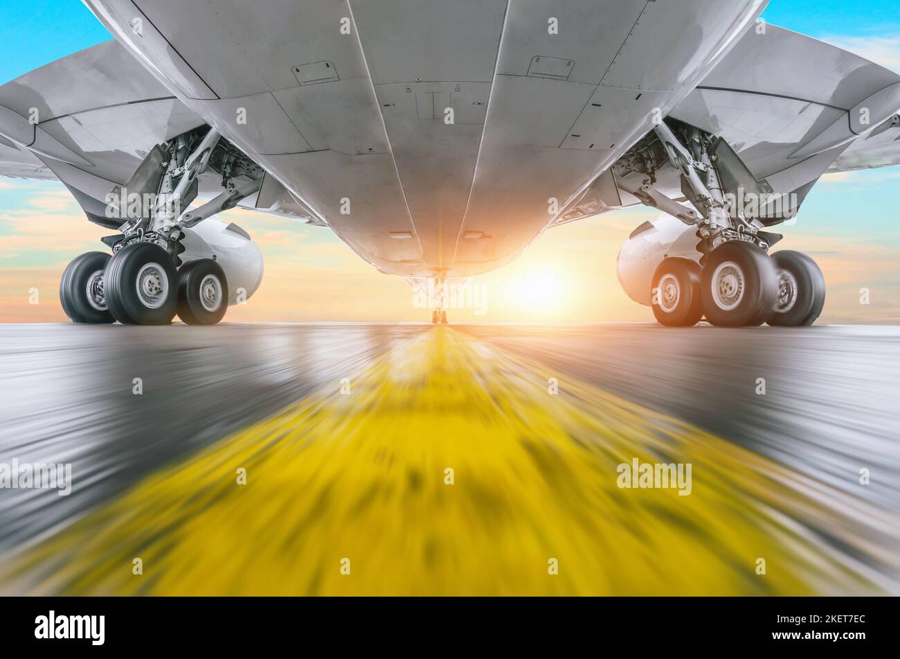 Airplane accelerates at high speed view from below bright light Stock ...