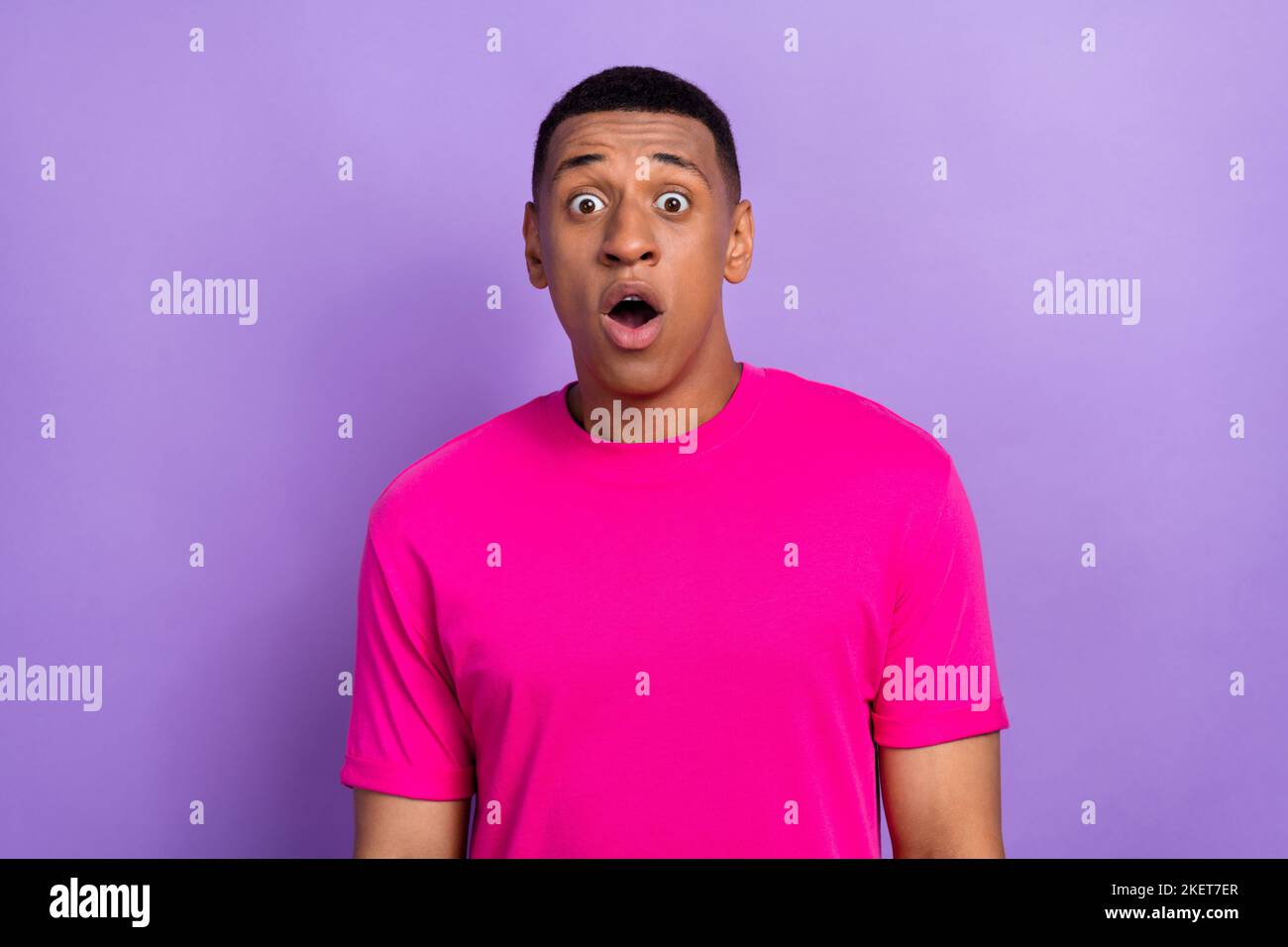 Photo of impressed speechless guy box haircut dressed pink t-shirt ...