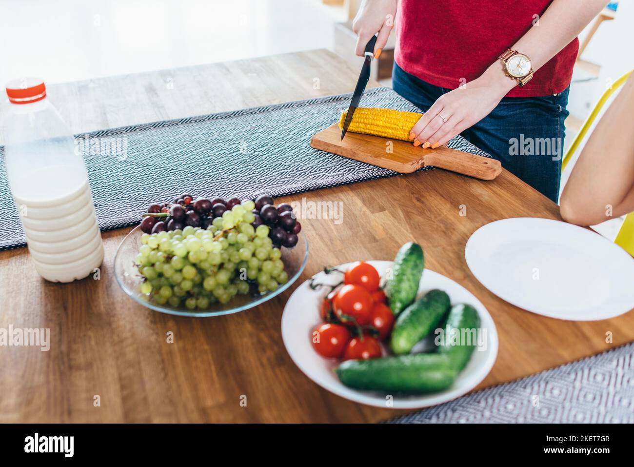 Woman hand cutting corn hi-res stock photography and images - Alamy