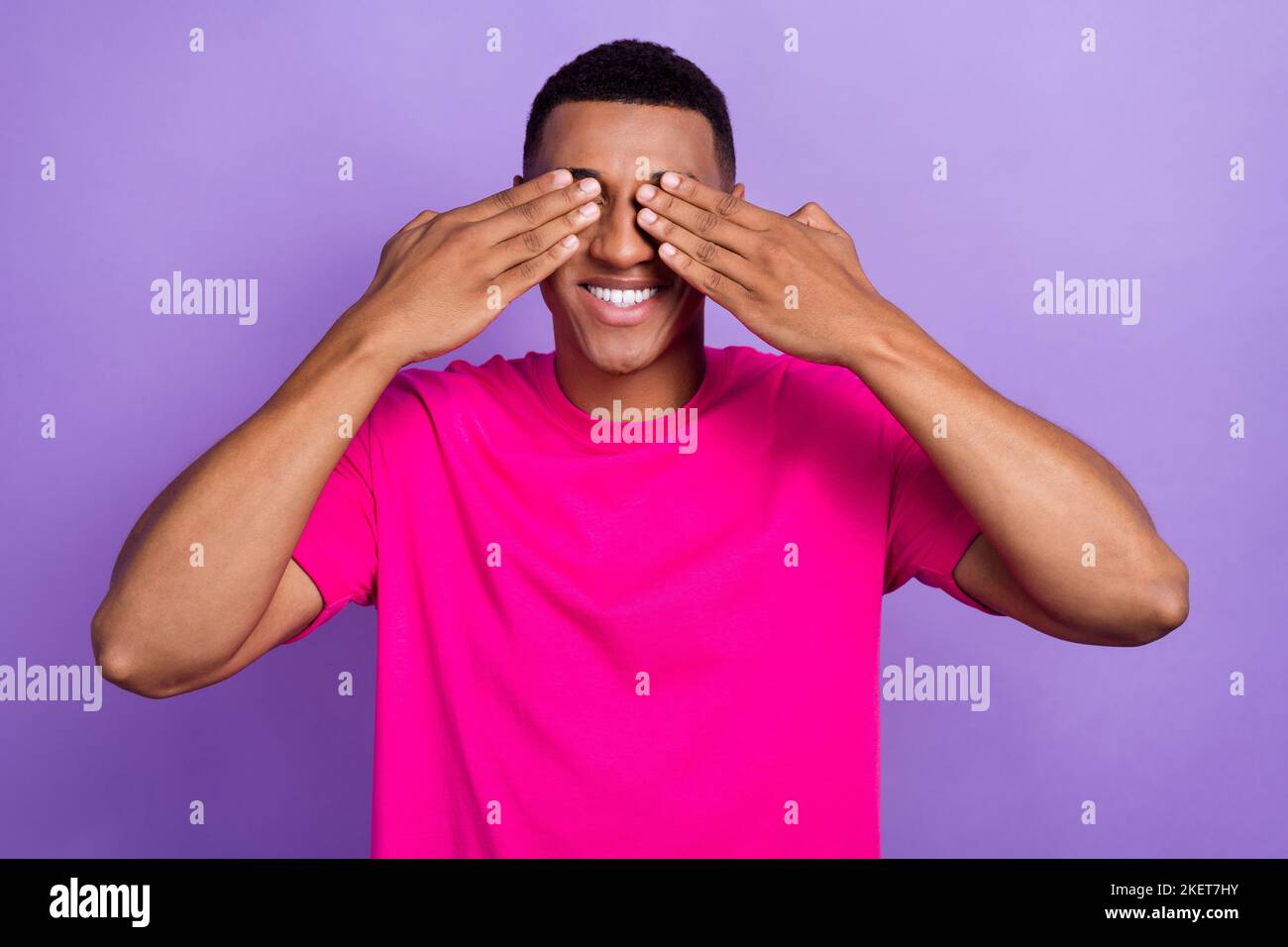 Photo of funky joyful man wear pink trendy clothes muscular arm cover ...