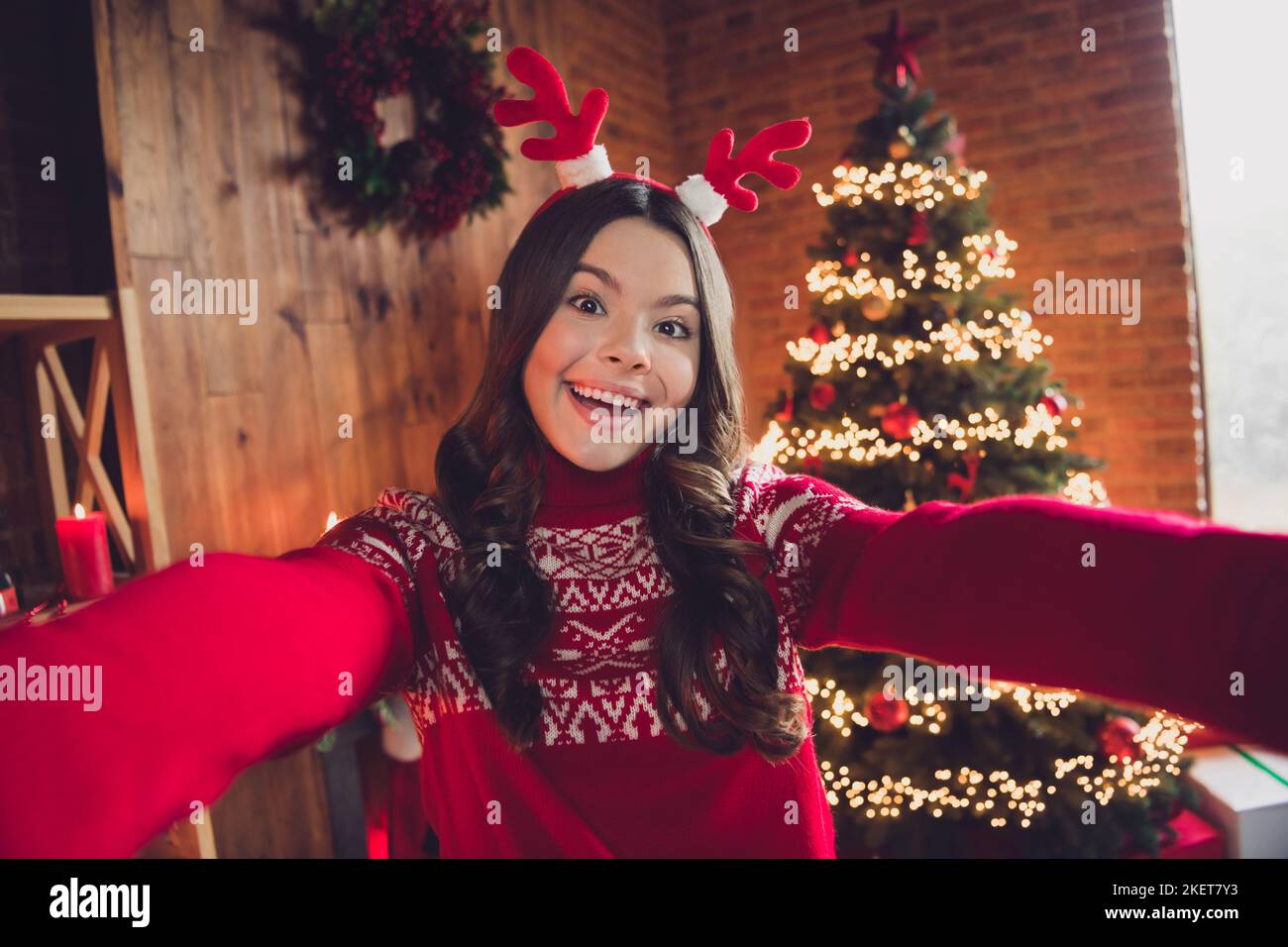 Photo of cheerful pretty lady recording video streaming new year theme ...