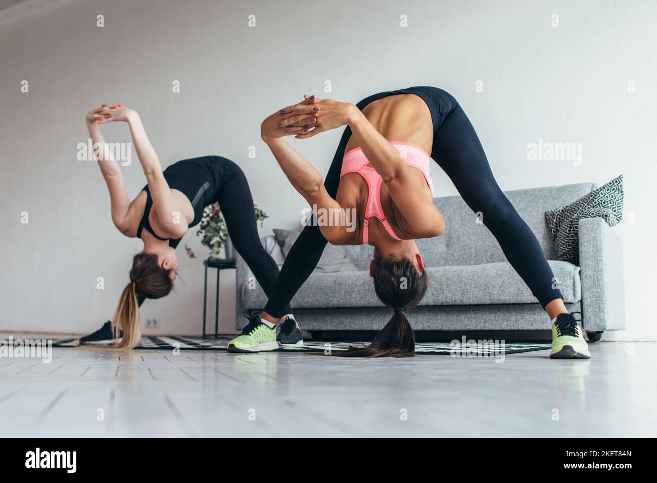 Fitness women back stretching training at home. Young slim girl makes ...