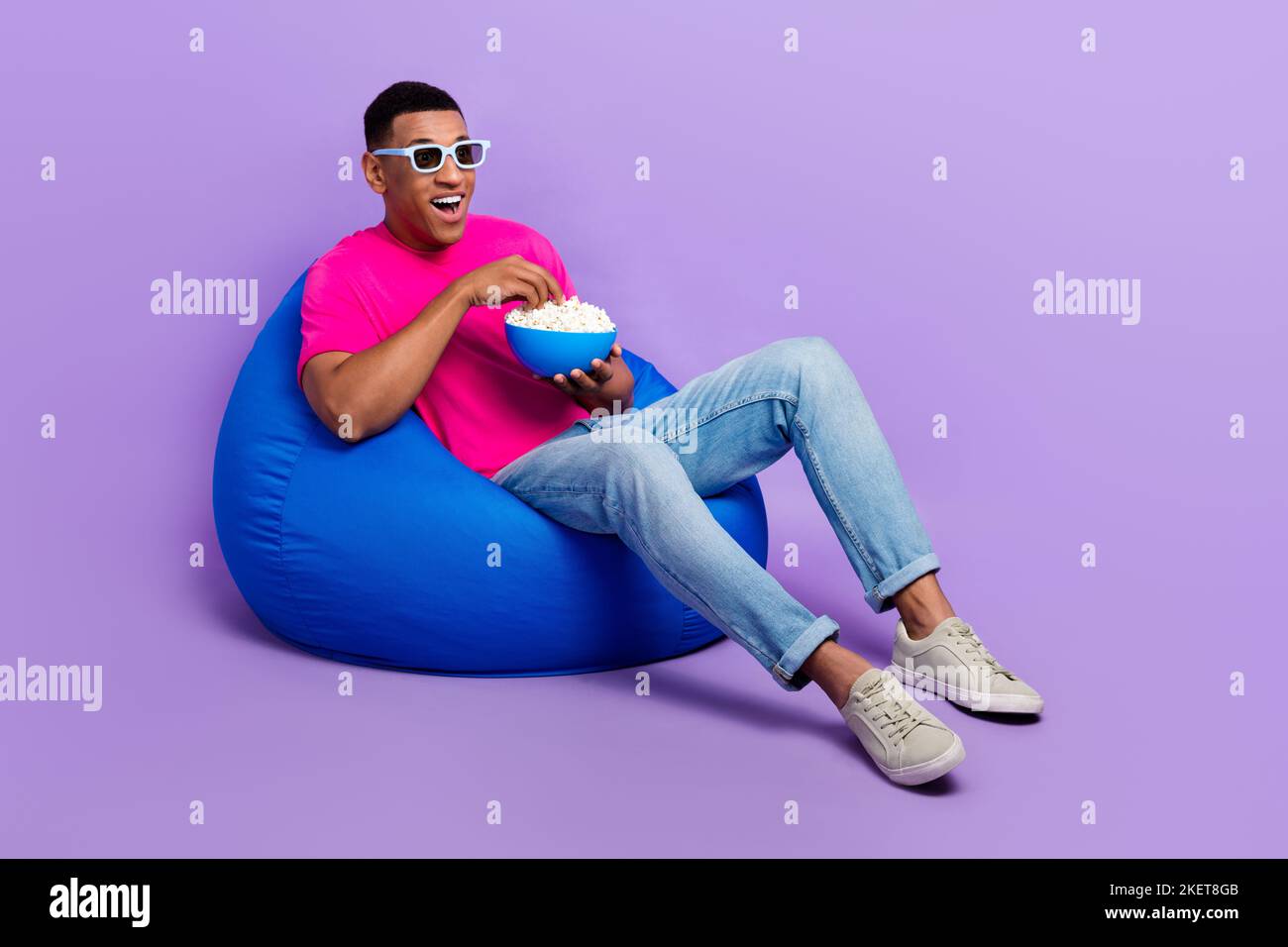 Full body photo of crazy astonished person sit cozy bag hold popcorn ...